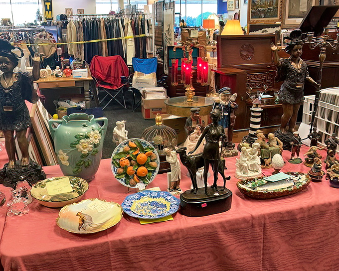This table tells a hundred stories—each figurine and decorative plate once graced someone's home before finding its way here.