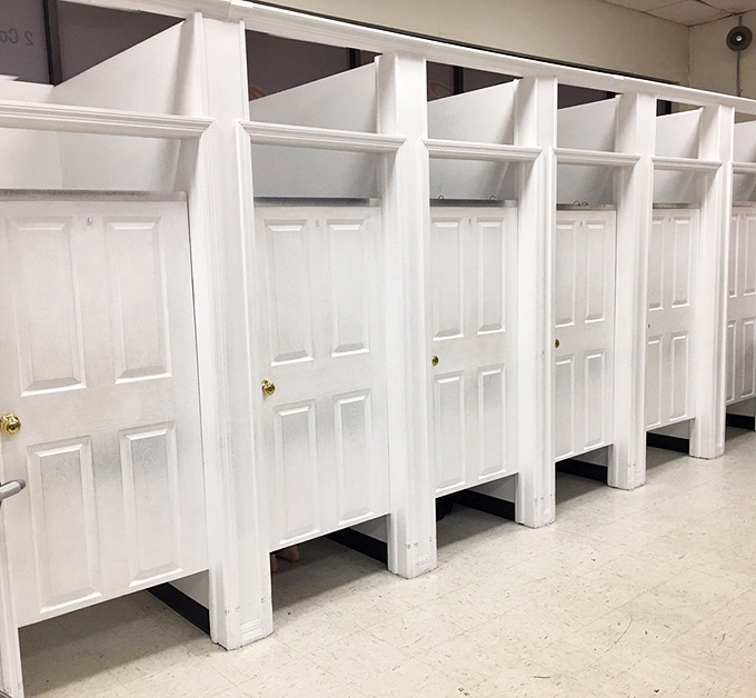 These dressing rooms may look like bathroom stalls, but they've witnessed more fashion transformations than Project Runway's entire series run.