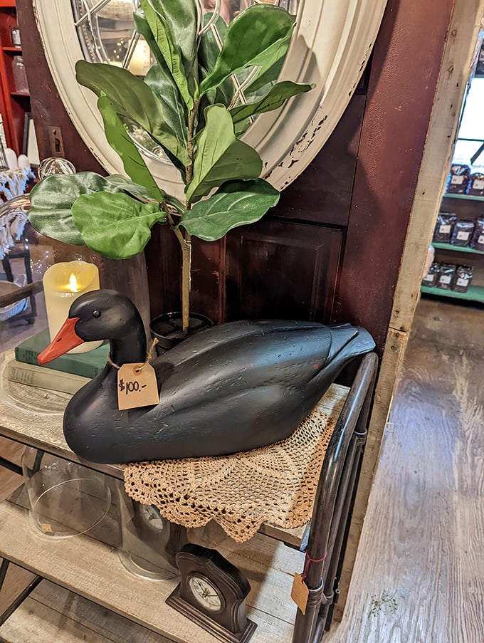 Not just any duck decoy—this handcrafted beauty brings a touch of rustic elegance to any home, perched on vintage lace.