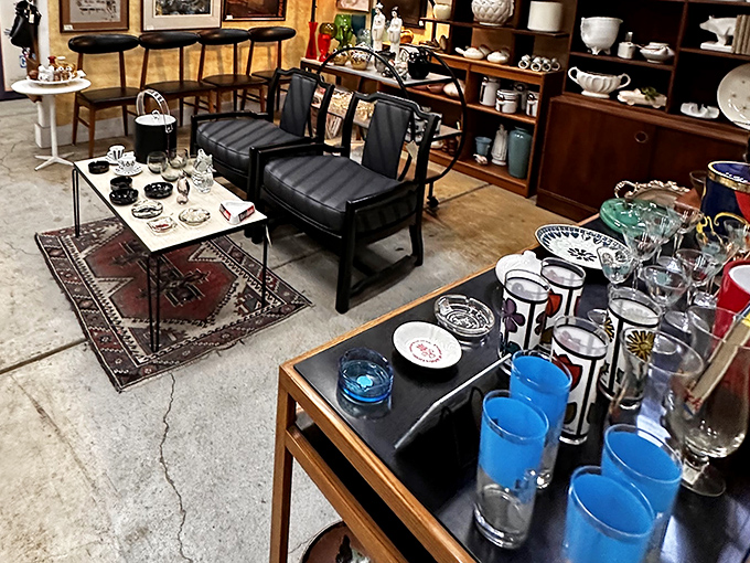 Mid-century modern meets timeless elegance in this carefully curated corner. Those blue Collins glasses are practically begging to host your next Manhattan.