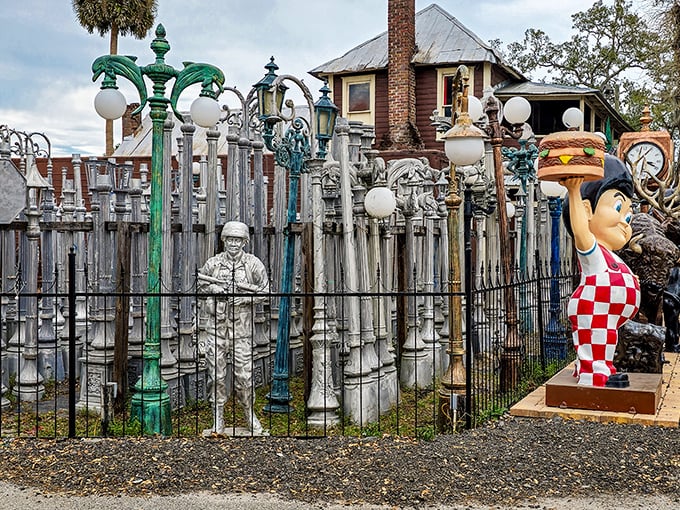 A forest of vintage lampposts creates an urban skyline in miniature, while a familiar burger-toting figure stands guard at the perimeter.
