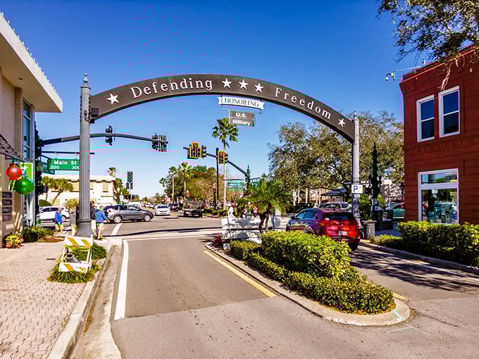 Main Street Dunedin isn't just a thoroughfare—it's the community's living room, where locals and visitors mingle under the watchful stars of the Freedom arch.