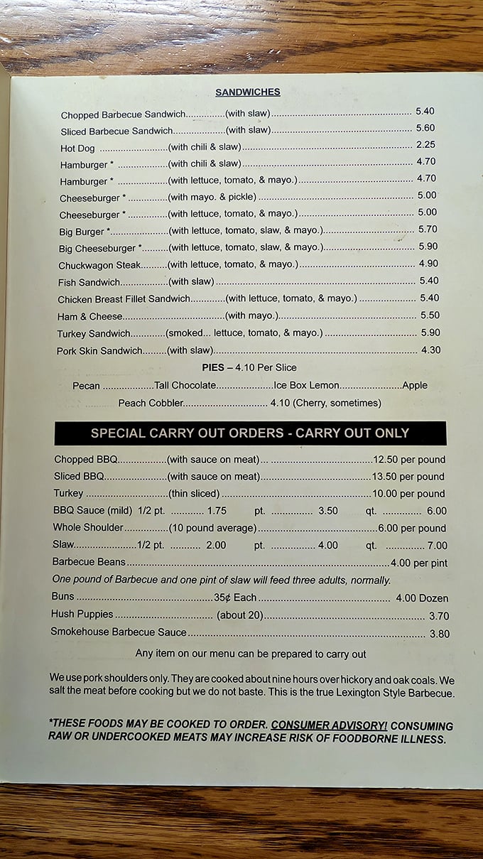 This menu isn't just a list of food—it's a manifesto. "Nine hours over hickory and oak coals" isn't a cooking method, it's a philosophy.