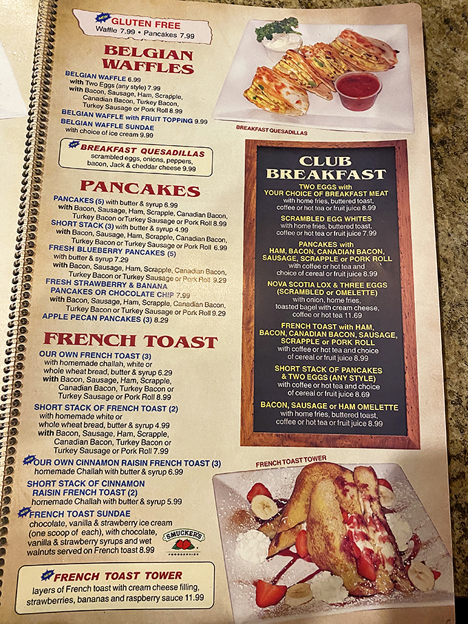 The menu – a spiral-bound epic that makes War and Peace look like light reading. Belgian waffles and challah French toast await your verdict.