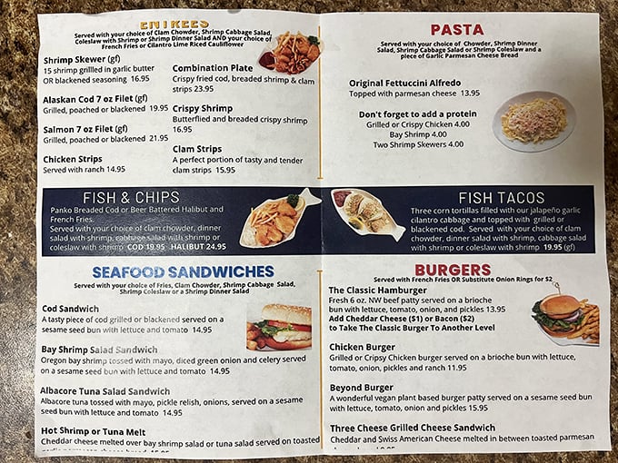 The menu reads like a love letter to Pacific Northwest seafood—fish tacos, clam strips, and combinations that make decision-making the hardest part of your visit.