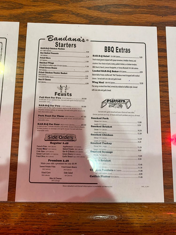 The menu reads like a love letter to smoked meat enthusiasts, with "Feasts" that could feed a small cavalry and sides that deserve their own spotlight.