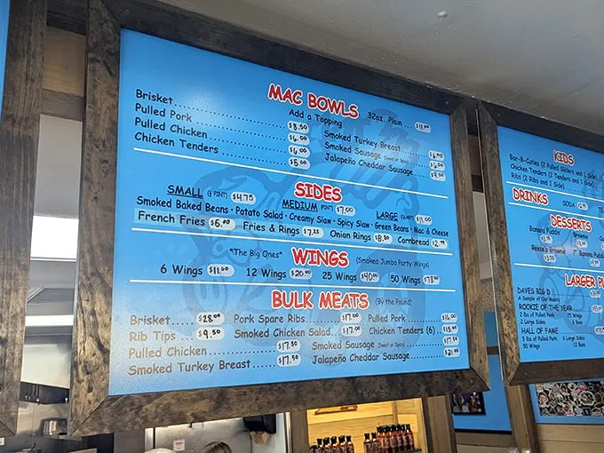 This menu board isn't just a list—it's a roadmap to happiness with brisket, pulled pork, and mac bowls that would make a cardiologist both worried and jealous.
