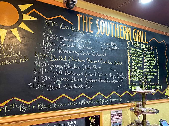 The chalkboard menu—a refreshing analog experience in our digital world—showcases Southern classics alongside unexpected treasures. Each handwritten item promises a story on a plate.