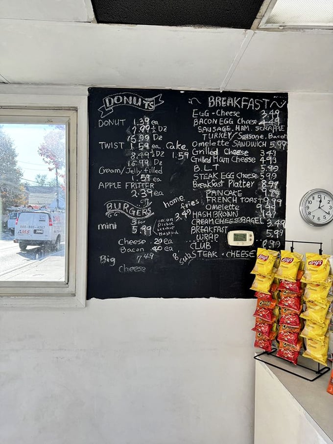 The handwritten chalkboard menu—a beautiful artifact from the pre-digital age—promises simple pleasures from donuts to burgers without a hint of pretension.