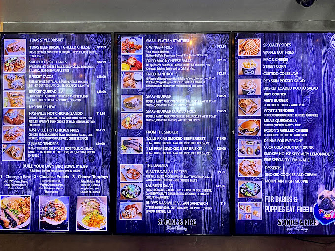 The menu board reads like a carnivore's bucket list—Texas brisket, Nashville hot chicken, and a special section for four-legged friends.