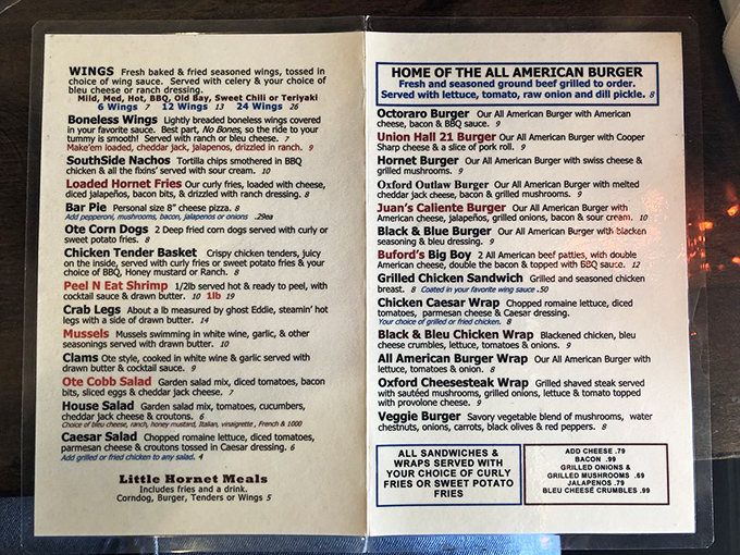 Sometimes the best discoveries hide in plain sight – like this menu promising "Home of the All American Burger."