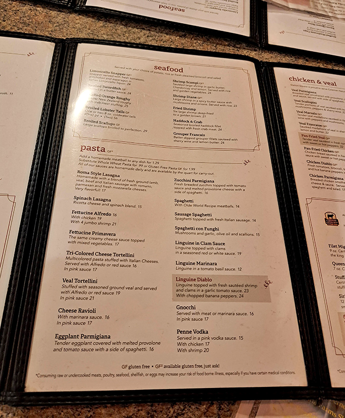The menu reads like a love letter to Italian cuisine with seafood playing a starring role. That crab cake isn't just listed—it's headlining.