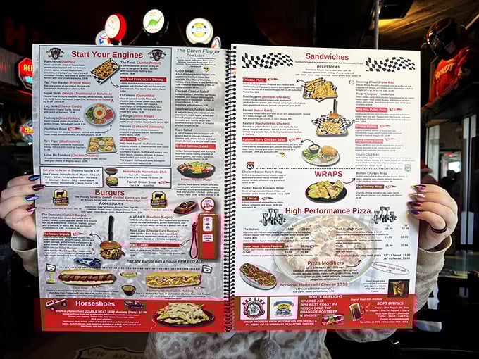 This isn't just a menu – it's a roadmap to culinary nostalgia with "Start Your Engines" appetizers and "High Performance Pizza" that'll make your taste buds do burnouts.