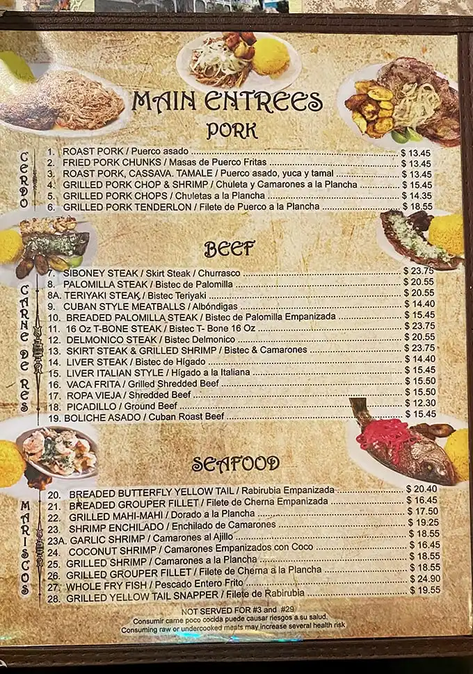 A menu that reads like a love letter to Cuban cuisine. Notice how your eyes immediately dart to the pork section? Trust that instinct.