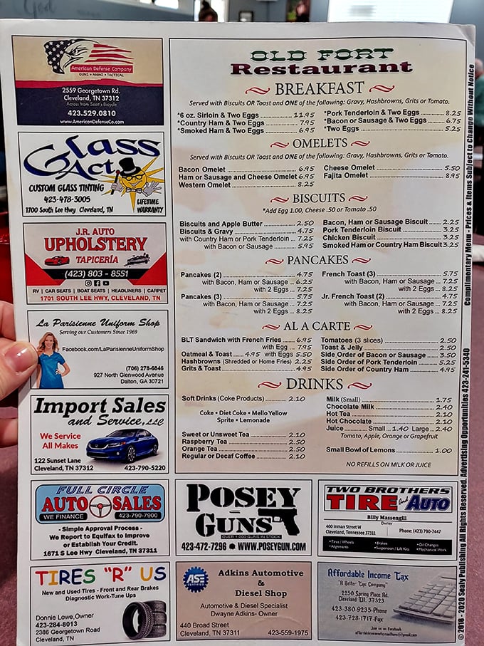 A menu surrounded by local business ads – the true mark of a community cornerstone. This laminated treasure map leads to culinary gold.