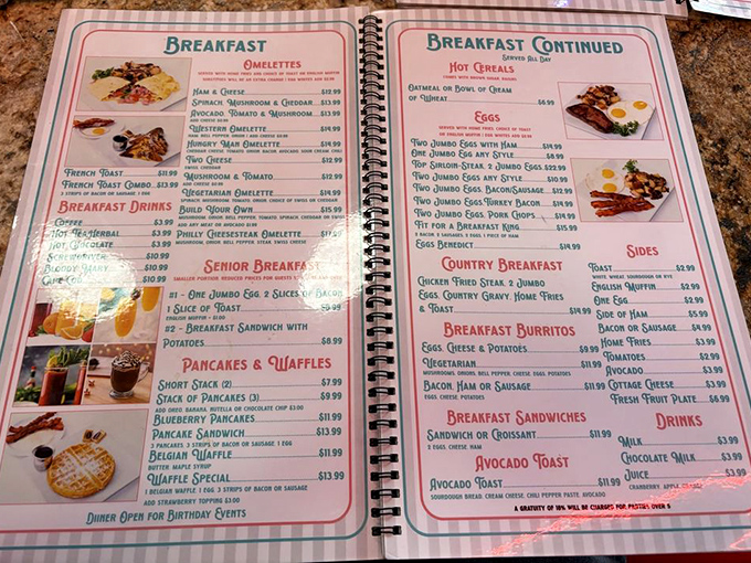 This spiral-bound menu isn't just food options—it's a historical document. Breakfast all day might be humanity's greatest achievement since indoor plumbing.