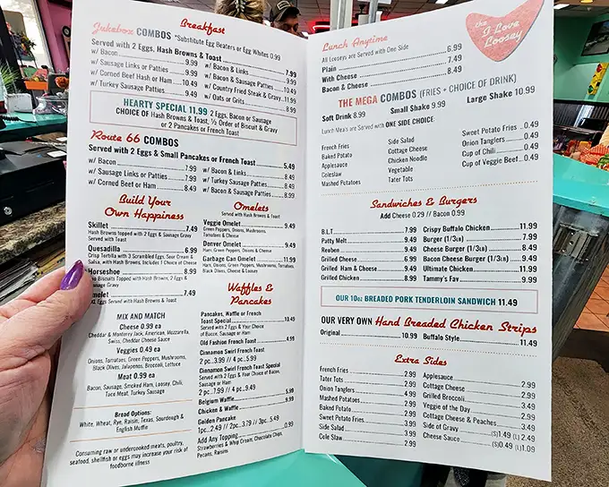 This menu isn't just a list of food—it's a roadmap to happiness. From "Build Your Happiness" omelets to "Route 66 Combos," every choice leads to satisfaction.