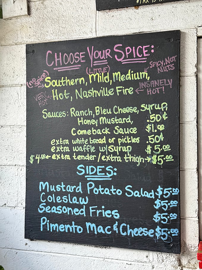 The spice level board is both menu and warning system. "Nashville Fire" isn't just clever marketing—it's a commitment that requires consideration and possibly medical insurance.
