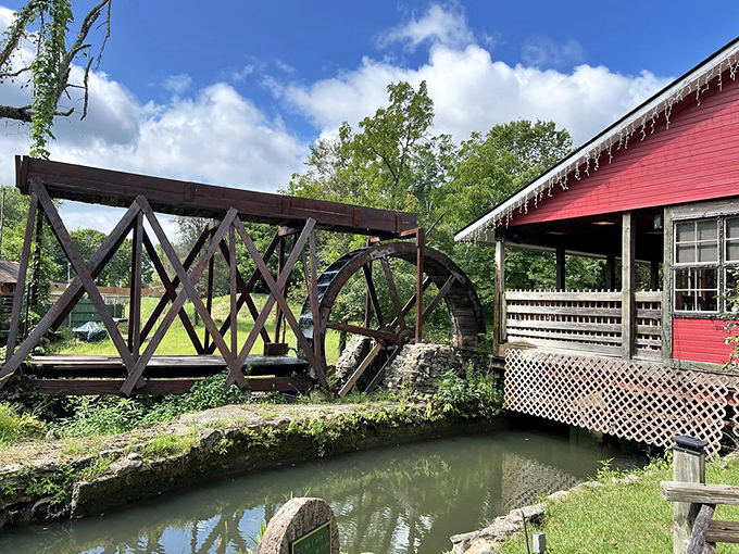 The massive water wheel isn't just for show—it's living history in motion, powering the mill just as it has for generations.