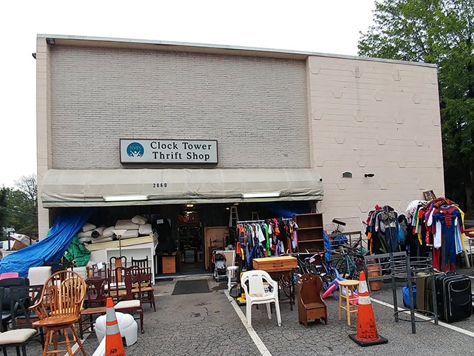 The sidewalk showcase—where furniture gets a breath of fresh air while waiting for its forever home.
