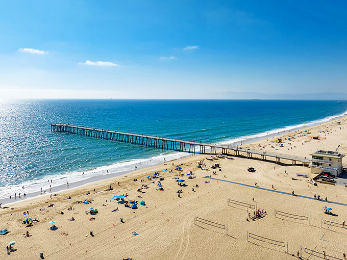 The Hermosa Pier stretches toward the horizon like a runway for dreams, inviting both sunrise joggers and sunset philosophers.
