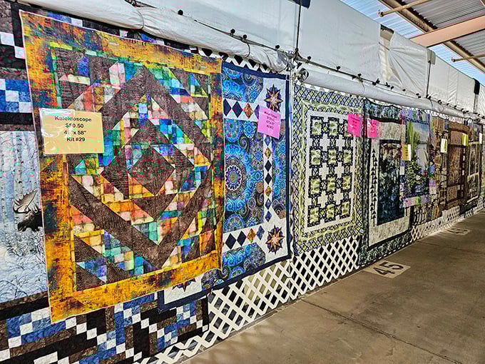 A tapestry of stories hangs before you. Each quilt represents countless hours of craftsmanship and tradition, waiting to warm both your home and heart.