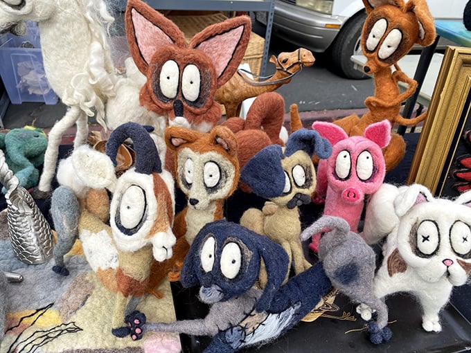 These wide-eyed felt creatures aren't judging your purchases—they're silently begging you to rescue them from their table of misfit toys.