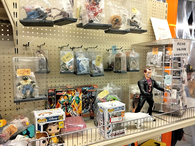 Action figures, collectibles, and nostalgic toys await behind plastic—guardians of childhood memories ready for their next adventure.