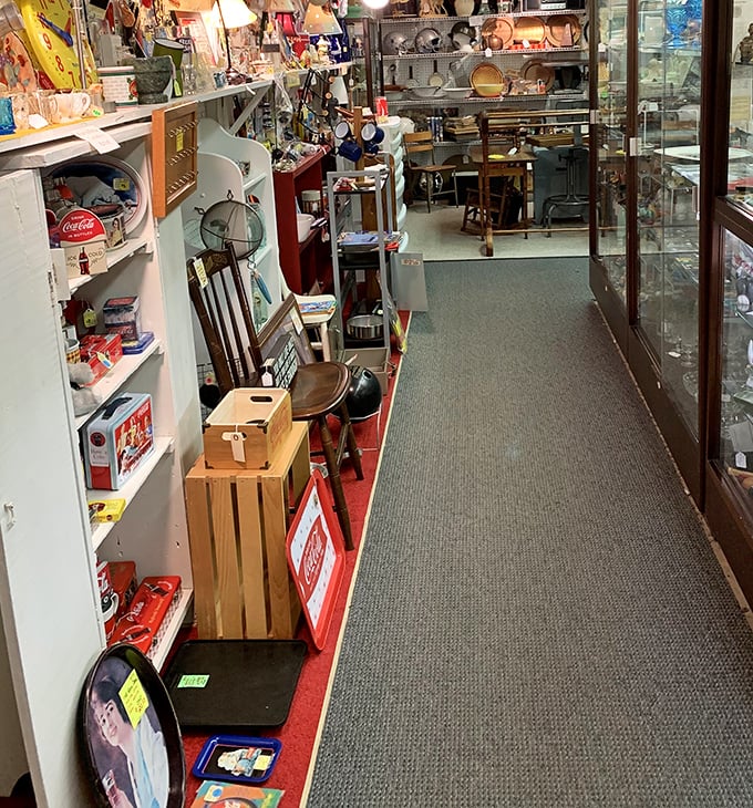 Narrow aisles packed with memories create the perfect treasure hunt atmosphere. Every turn reveals another vendor's carefully curated collection of yesteryear.