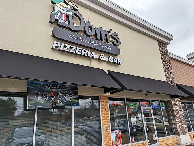 Dom's sign promises New York style, and the pizzeria delivers. No bridge tolls required for this authentic slice of the Big Apple.