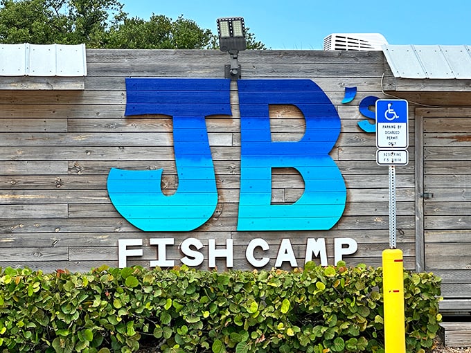 That gradient blue sign promises the kind of no-nonsense fish camp experience that's becoming endangered in modern Florida.