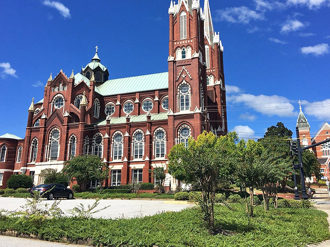 Macon's stunning red brick church reaches skyward with architectural ambition. Gothic grandeur that would make Notre Dame nod in approval!