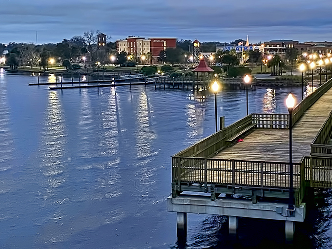 Palatka's riverfront boardwalk glimmers at twilight, proving waterfront magic doesn't require a millionaire's budget.