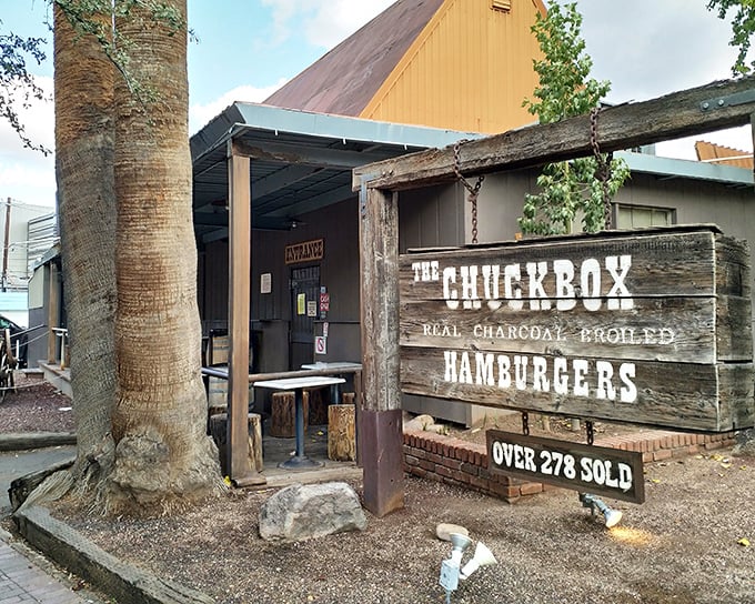 The Chuck Box's rustic wooden sign promises "real charcoal-broiled hamburgers" – a claim your nose will verify before you even order.