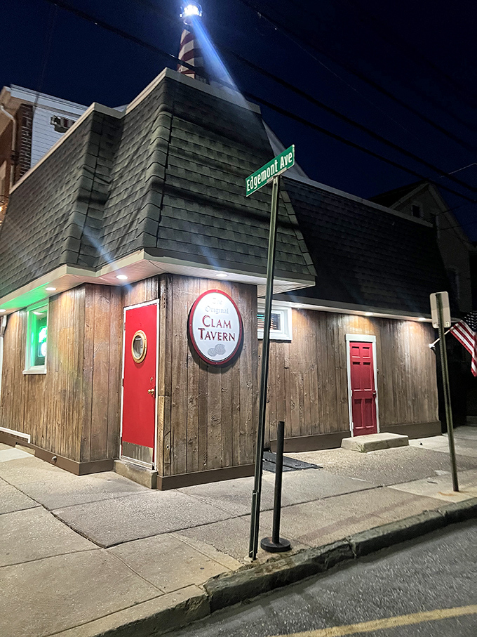 Lighthouse meets tavern in this wooden wonder. That red door is basically a portal to clam paradise after dark.