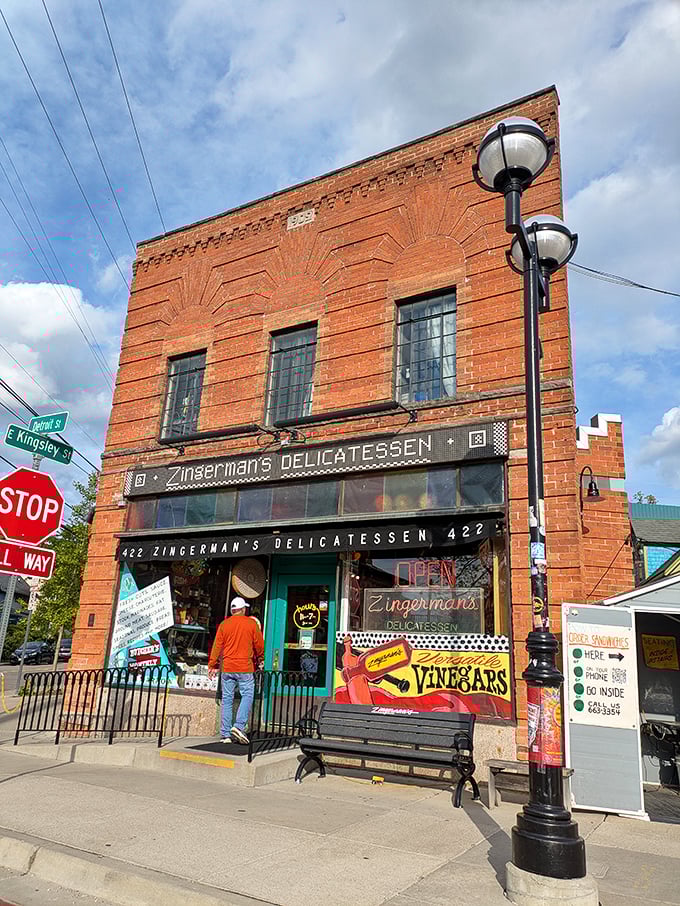 That classic brick storefront on Detroit Street houses more sandwich magic than most food lovers dare dream.