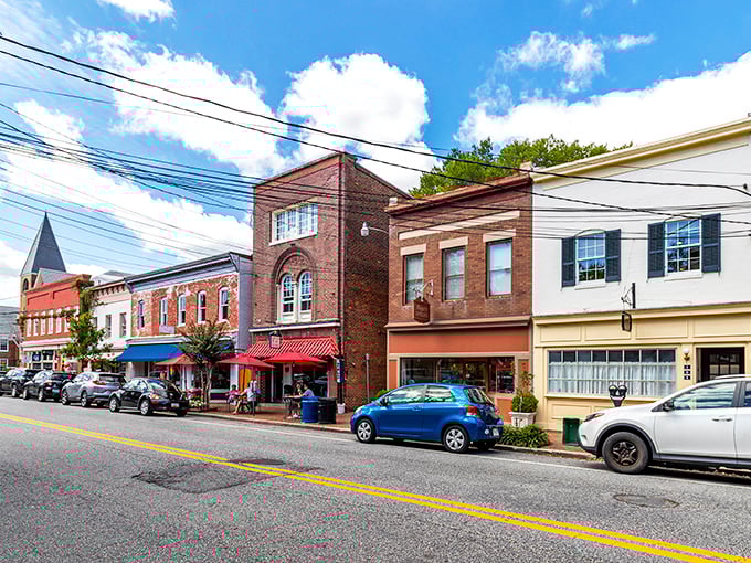 Red brick buildings stand shoulder to shoulder like old friends who've weathered centuries of stories together.