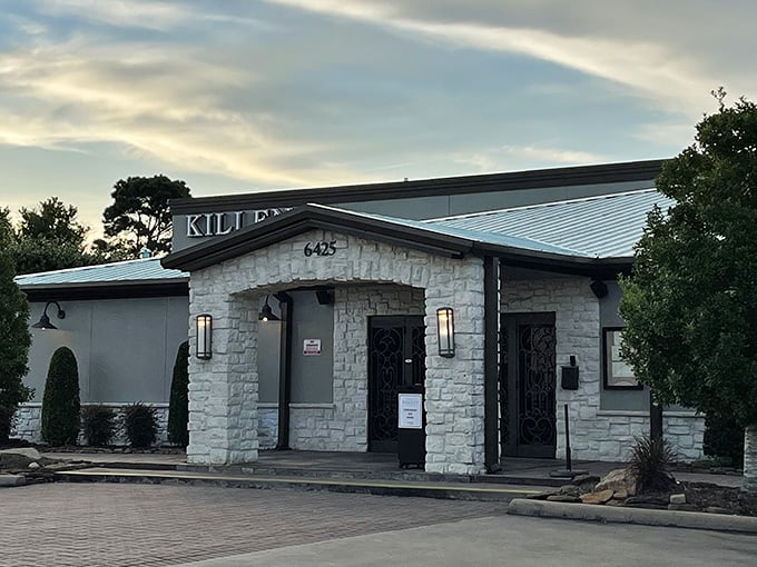 Evening at Killen's Steakhouse—where the stone exterior gives way to a warm glow that whispers, "Come hungry, leave happy."