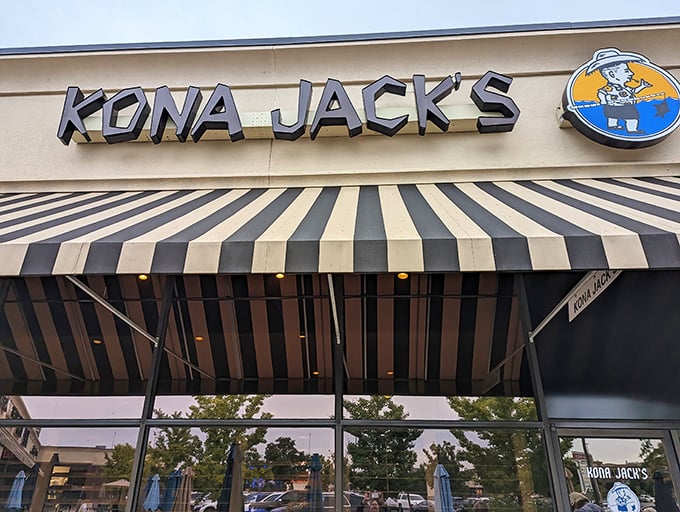 That striped awning hints at the tropical escape waiting inside – no passport or sunscreen required.