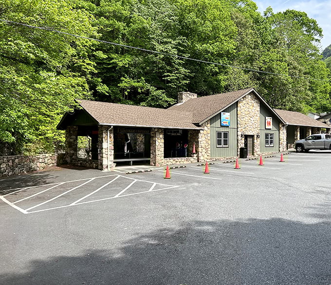 Summer outside, eternal autumn inside. The stone lodge entrance to Linville Caverns promises subterranean wonders.