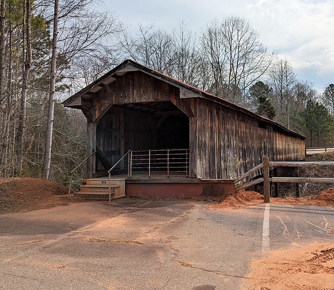 Ole Gilliam's wooden gateway stands ready for your next country drive. The kind of place that makes you slow down—by design.