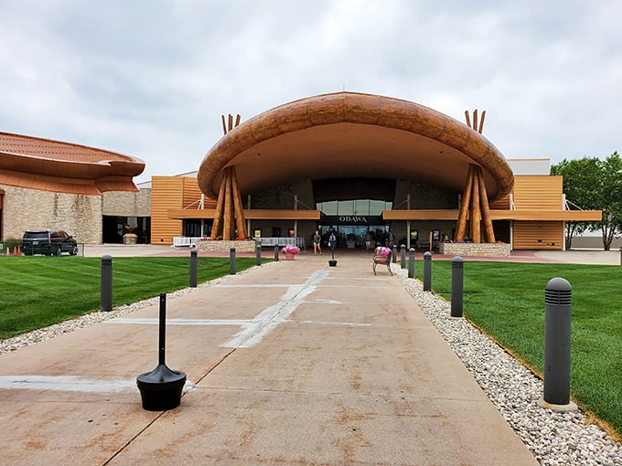 The striking architecture of Odawa Casino in Petoskey welcomes visitors with its warm, wood-inspired design and promises of entertainment just steps inside.