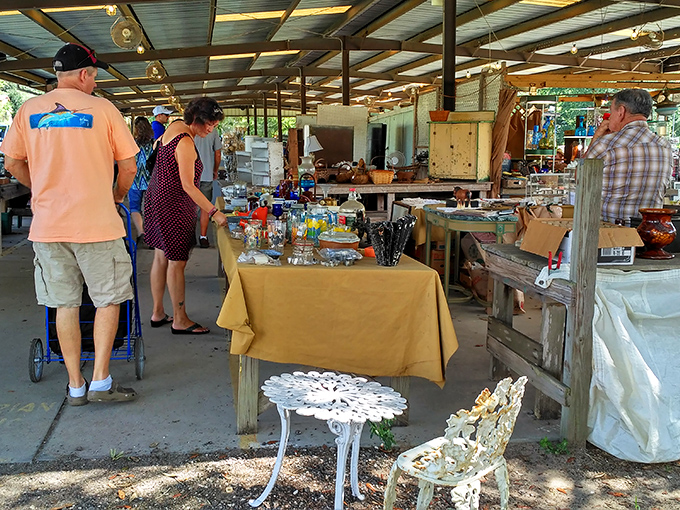 Shoppers browse under the open-air canopy, where yesterday's castoffs become tomorrow's conversation pieces.