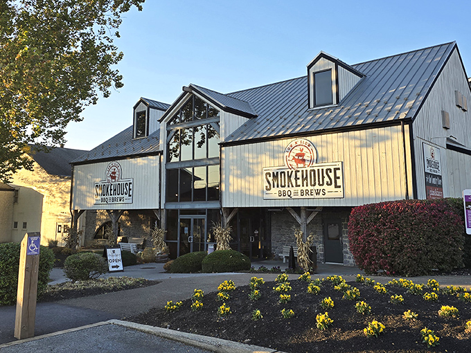 This impressive white barn houses smoky treasures within. The windows practically fog with the aroma of slow-cooked perfection!