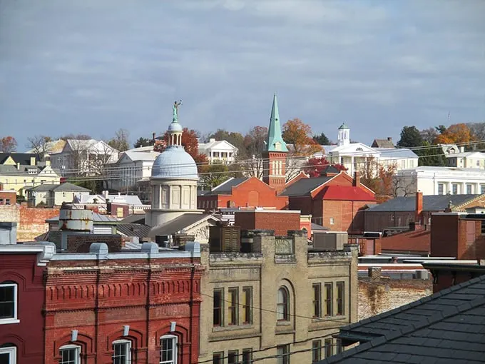 Downtown Staunton glows in golden hour light, its historic buildings standing proud against a backdrop of blue sky.