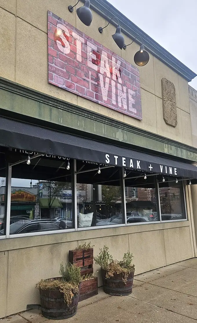 That rustic brick sign promises what lies within – a temple to perfectly seasoned, expertly seared beef that'll haunt your dreams.