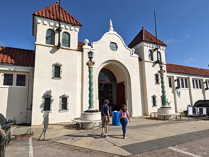 Elegant arches welcome treasure seekers to the Raleigh Flea Market, where history and haggling harmoniously coexist.