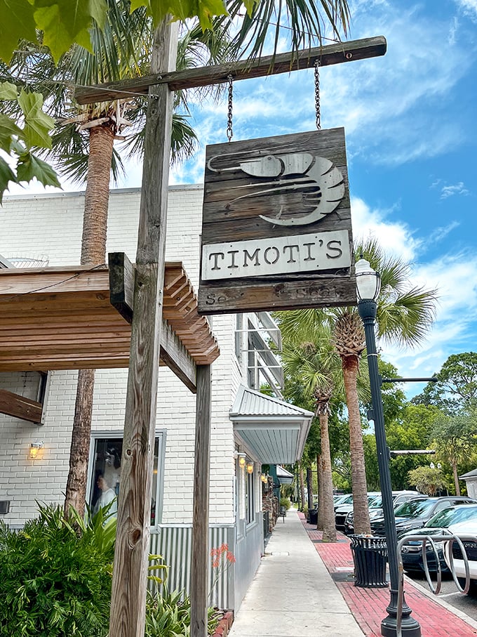 White brick walls and a weathered shrimp sign—Timoti's looks like it was plucked from a coastal postcard. Simple outside, seafood symphony inside.