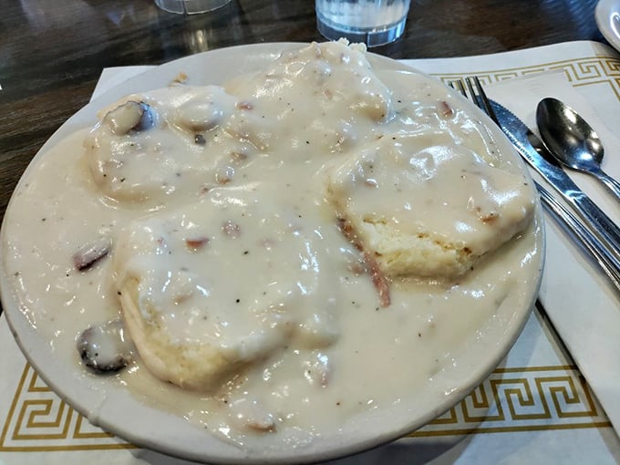 Biscuits and gravy so rich they should have their own tax bracket. This plate doesn't just feed you—it hugs your soul from the inside.