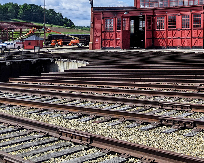 History on the rails. The vibrant red depot stands as a colorful reminder of when trains were the superhighways connecting America's small towns.
